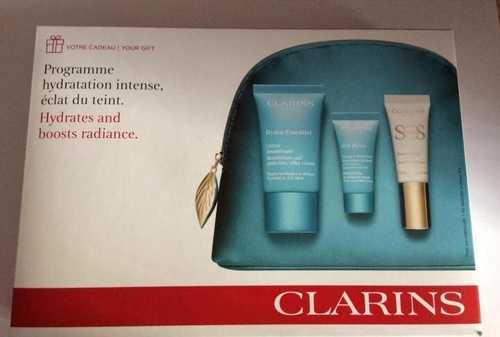 Пробники clarins. Кларанс крем набор. Clarins подарочный набор в коробке. Косметичка увлажнение Clarins. Набор кларанс крема в косметичке новогодней.