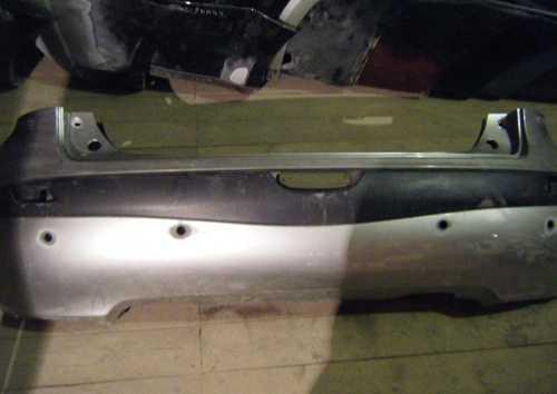 Бампер задний 850229U040 Nissan Note (Ниссан Ноут)