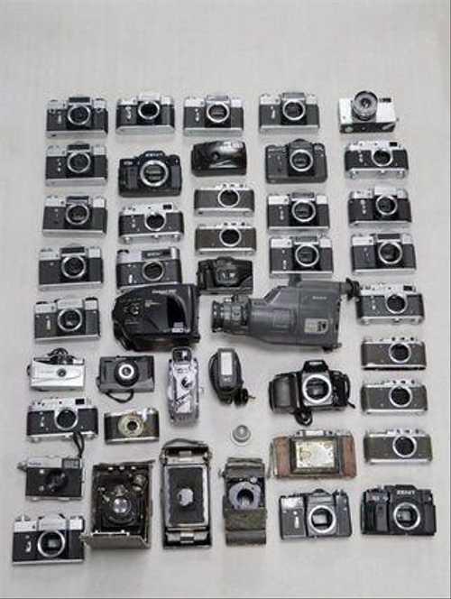 Фотоаппараты (38 штук), видеокамеры и принадлежнос