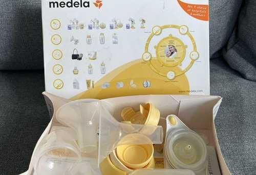 Молокоотсос medela ручной + бутылочки