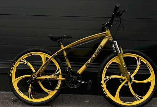 Велосипед на литых дисках Кано золотой