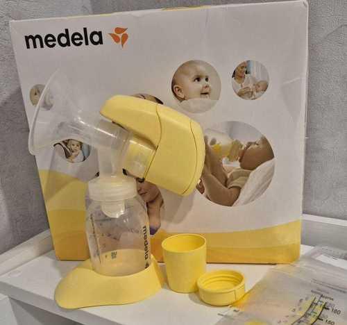 Молокоотсос medela электрический