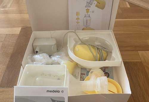 Молокоотсос medela электрический