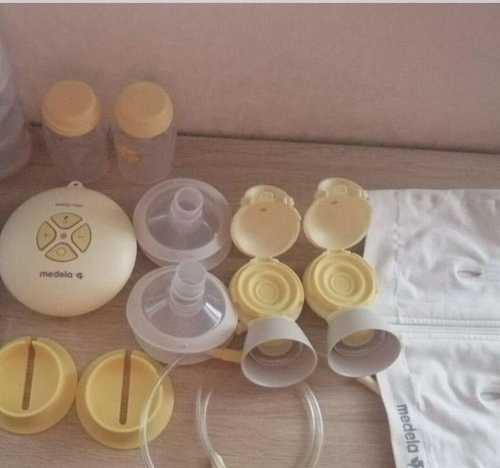 Молокоотсос medela swing maxi flex