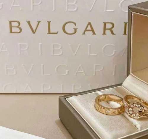 Золотые обручальные кольца Bvlgari 14 гр 0.32 ct