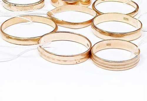 Золотые деформированные обручальные кольца