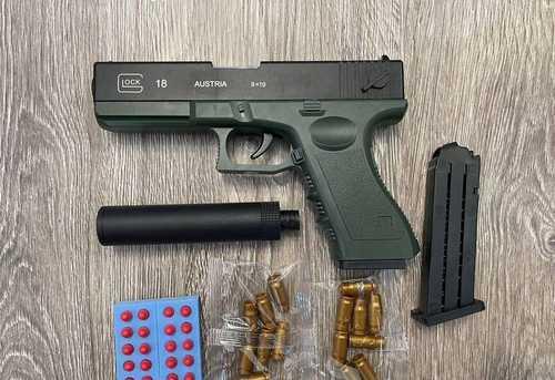 Пластиковый пистолет glock с гильзами и глушителем