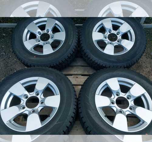 Нива Зима шипы R15 205/70 Hankook 5x139.7 Skad