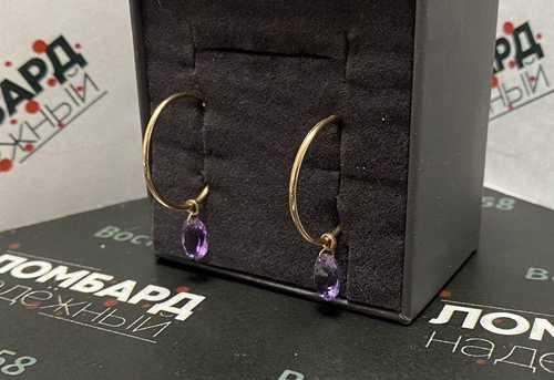 Золотые серьги кольцами с фиолетовыми камнями