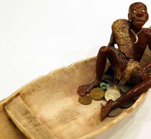 Керамическая статуэтка - Афро Американец в лодке