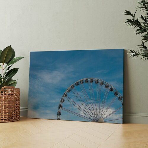 Картина на холсте "Большое колесо обозрения, сидящее под облачным голубым небом" 20x30 см. Интерьерная, на стену.