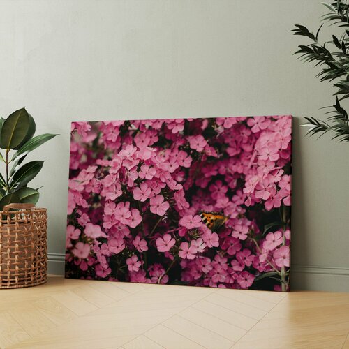 Картина на холсте "Желтая и черная бабочка сидит на вершине розовых цветов" 40x60 см. Интерьерная, на стену.