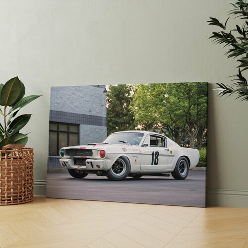 Картина на холсте "Белая гоночная машина припаркована перед зданием" 50x70 см. Интерьерная, на стену.